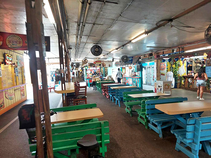 The food court's colorful seating area invites shoppers to rest weary feet and refuel for the next round of bargain hunting adventures.