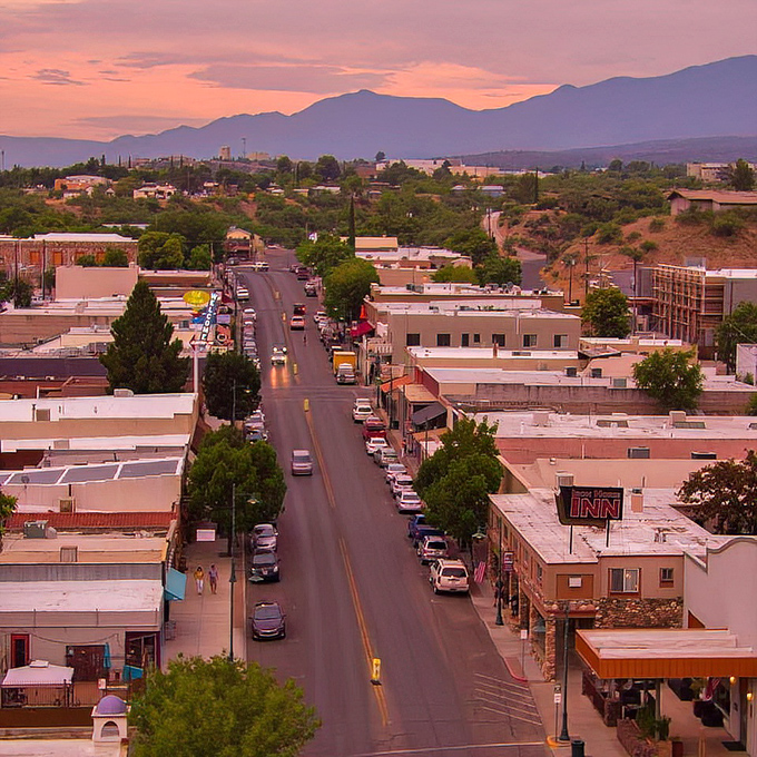 Sunset paints Cottonwood's main drag in pastel hues, turning an ordinary street into a photographer's dream as the mountains stand sentinel.