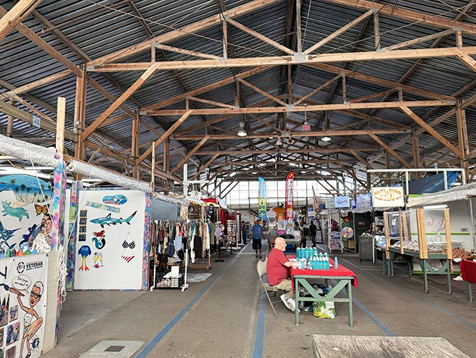 Under rustic wooden beams, vendors display their wares in an open-air section that feels like a small-town marketplace frozen in time.