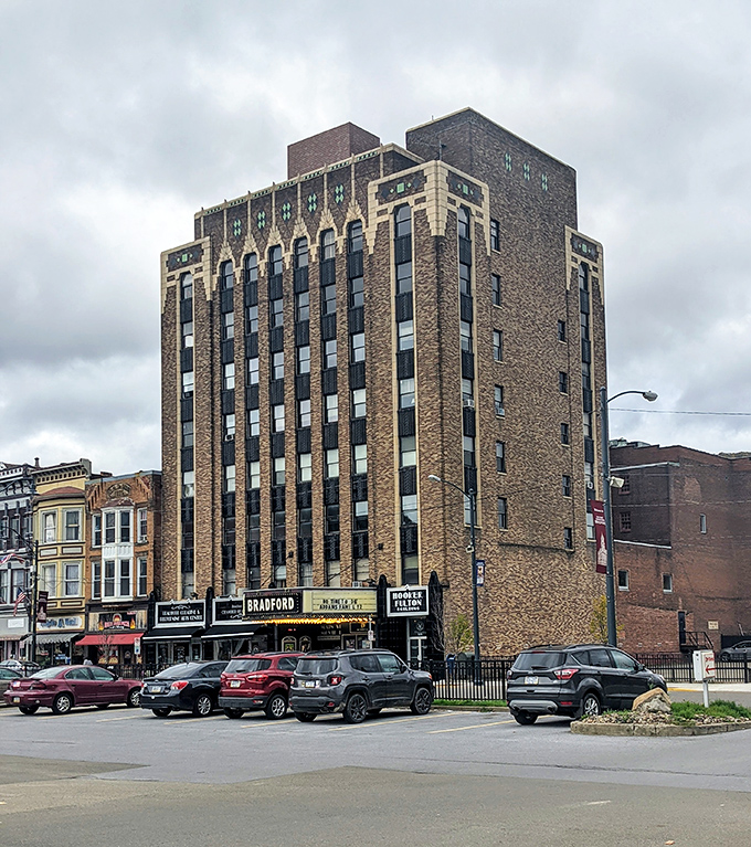 The historic Bradford Theater building stands tall, a brick sentinel watching over generations of moviegoers and downtown shoppers.