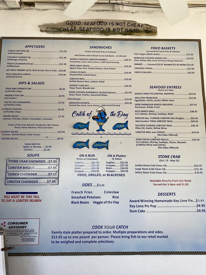 A menu that reads like poetry to seafood lovers. The wooden sign above speaks truth: "Good seafood is not cheap, cheap seafood is not good."