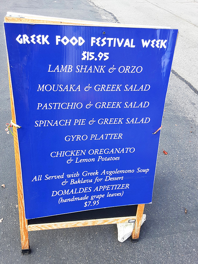 The Greek Food Festival Week sign promises Mediterranean magic &ndash; lamb shank, moussaka, and baklava that'll transport you straight to Athens.
