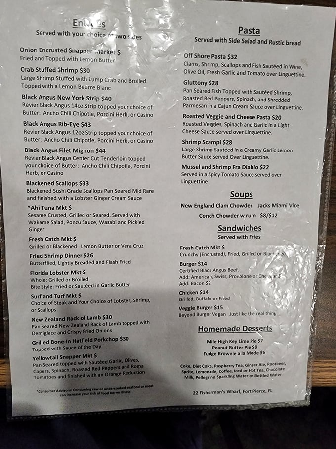 A menu that reads like a love letter to seafood lovers. When you see "w rum" next to those chowders, you know someone in the kitchen understands flavor.