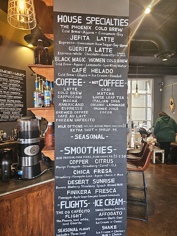 This chalkboard menu isn't just listing drinks&mdash;it's offering a roadmap to your perfect morning with intriguing names like "Black Magic Women Cold Brew."