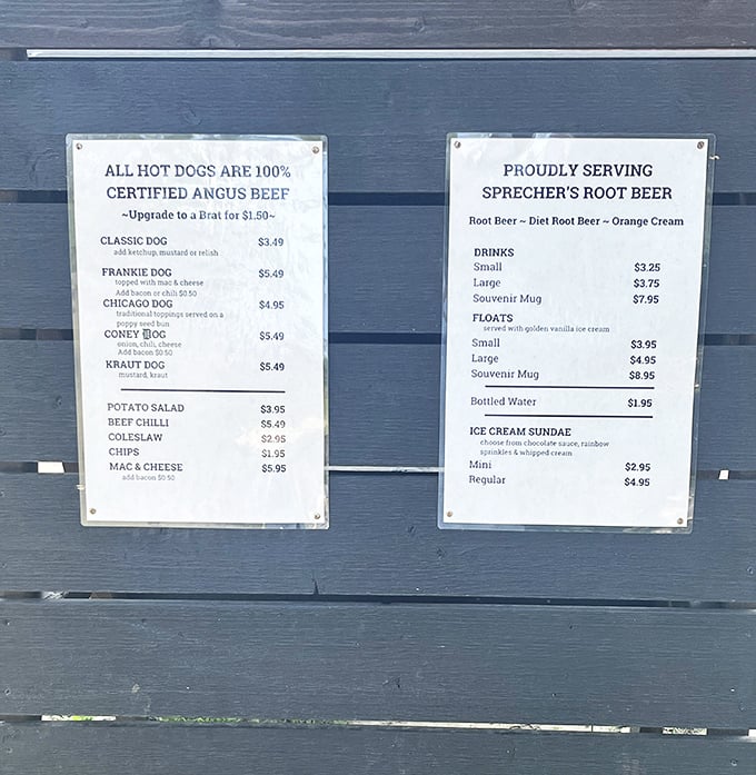 The menu board tells a simple story: quality dogs, cold root beer, and the promise of summer bliss without pretension.