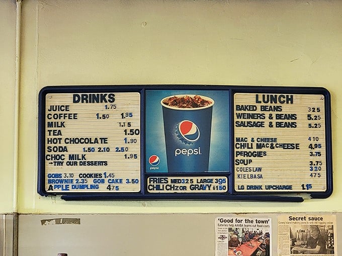 A menu board that's refreshingly analog in our digital world. No QR codes here&mdash;just honest food at prices that feel like a clerical error in 2023.