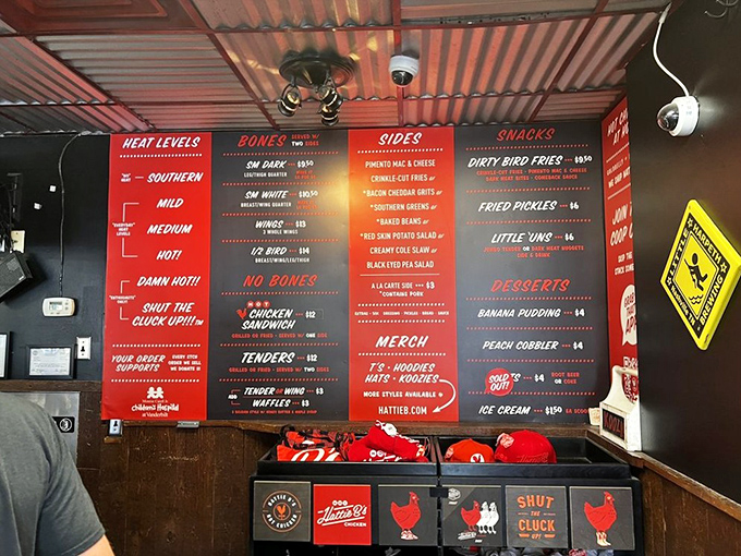 The menu board reads like a heat index warning system. "Shut the Cluck Up!!!" isn't just clever wordplay&mdash;it's a dare wrapped in cayenne.