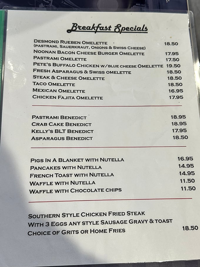 This menu reads like a love letter to breakfast indulgence. The Desmond Reuben Omelette and "Pigs in a Blanket with Nutella" prove someone's grandmother is clearly running the kitchen.