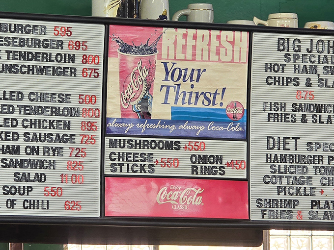 A menu board that cuts to the chase: no flowery descriptions, just straightforward promises of deliciousness. The vintage Coca-Cola ads aren't retro&mdash;they're original.