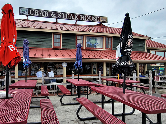 Nothing says "Chesapeake Bay dining" quite like red picnic tables, blue umbrellas, and a sign promising both crabs and steaks&mdash;the surf and turf of small-town dreams.