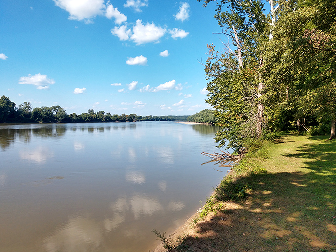 The Wabash River doesn't just flow, it meanders with purpose, reflecting clouds so perfectly you'll wonder which way is up at Harmonie's western edge.