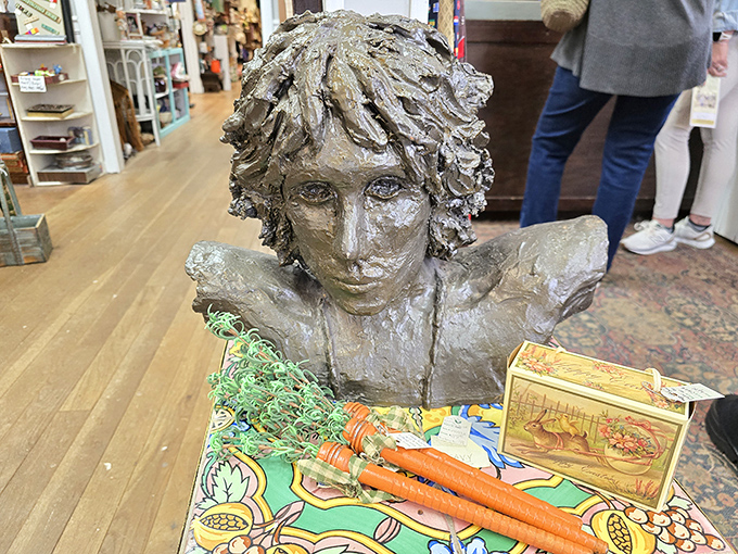 This bronze bust seems to be silently judging your purchases, wondering if you're truly worthy of that vintage salt and pepper set.