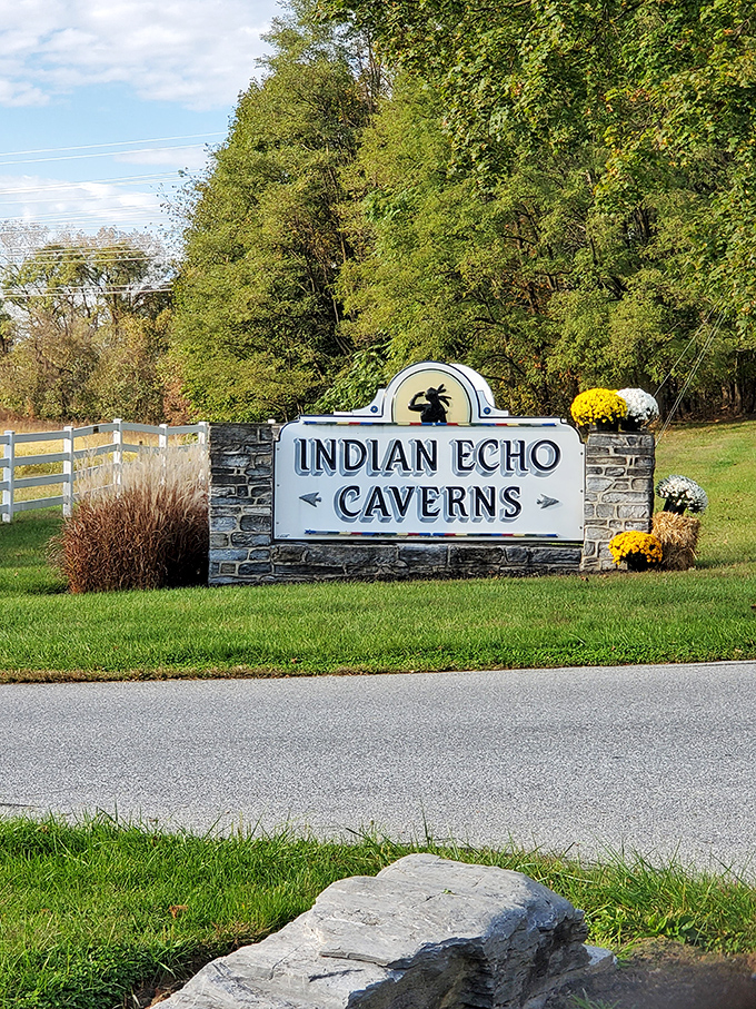 The unassuming entrance sign gives little hint of the subterranean wonderland waiting just beyond those trees.