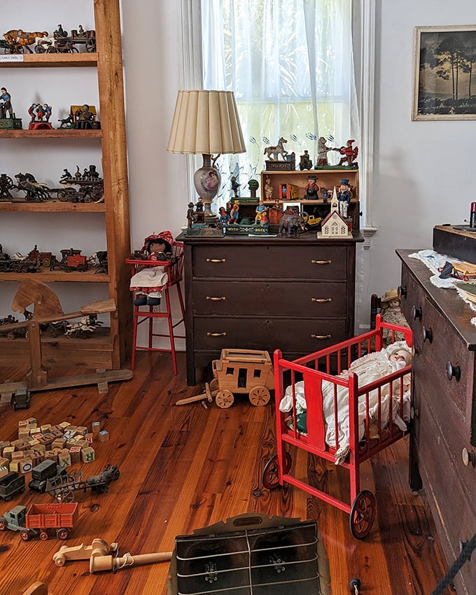 Vintage toys that would make any collector swoon line this playroom. The red crib practically screams "don't turn your back on me" in the most delightful way.