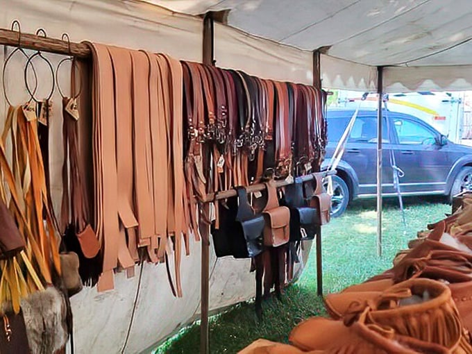 Leather craftsmanship on full display &ndash; belts, bags, and wallets hanging like an artisan's color wheel. That perfect belt you've been searching for your whole life? It's probably here.