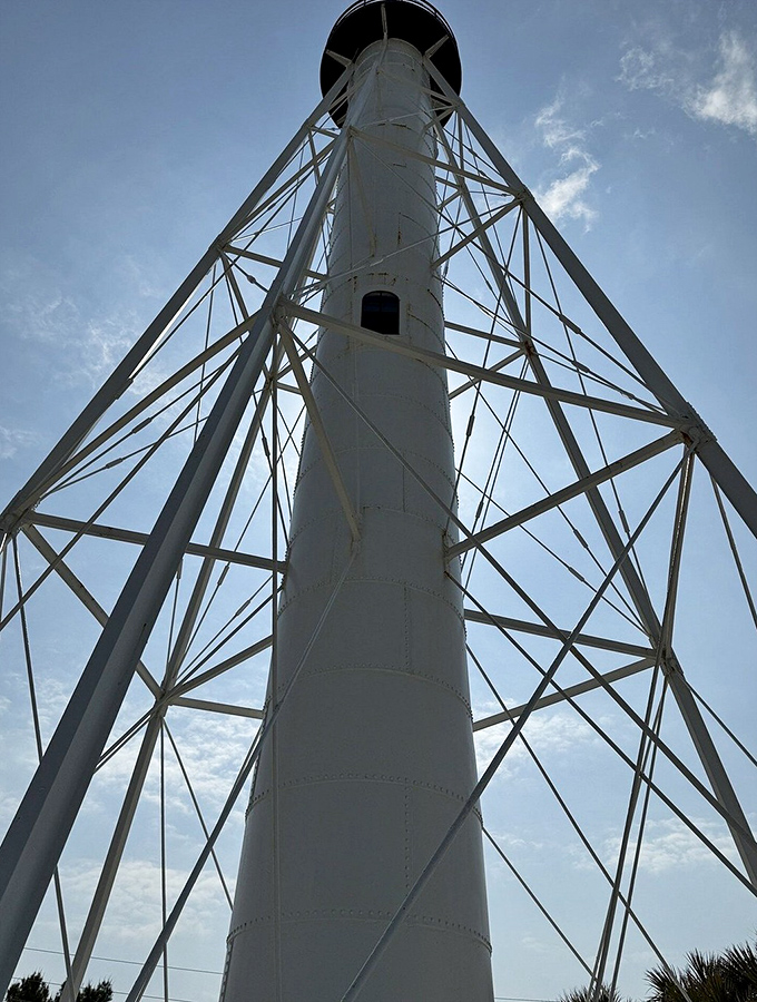 Looking up never felt so inspiring. The lighthouse's geometric precision creates a mesmerizing pattern that's part industrial art, part maritime guardian.