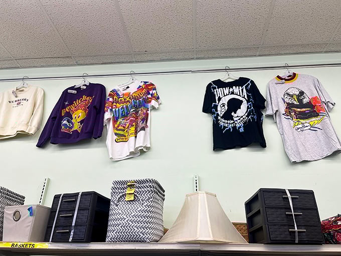 Vintage tees hanging like rock band backstage passes from another era. That POW-MIA shirt has probably seen more history than most high school textbooks.