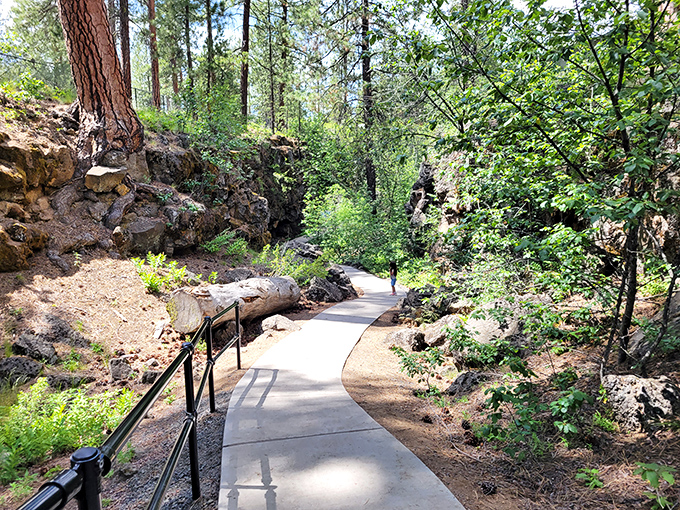 The approach to adventure begins on this well-maintained path. Surrounded by ponderosa pines and volcanic formations, it's the perfect prelude to the underground journey ahead.