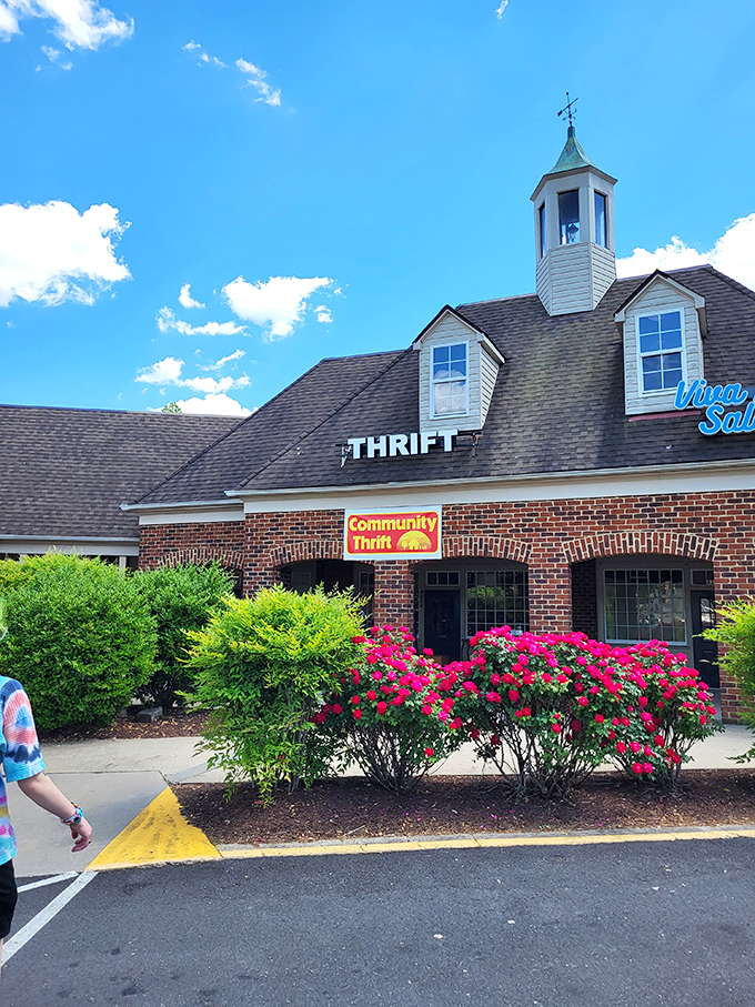 Brick charm meets blooming azaleas - even the landscaping here knows how to make shoppers smile.