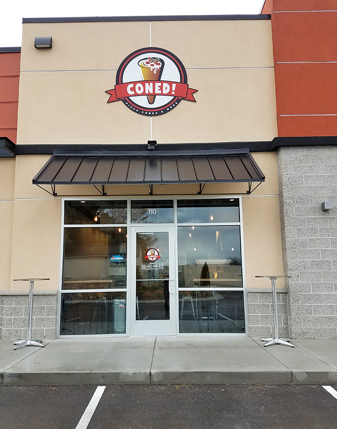 "Pizza in a cone? What sorcery is this?" The Coned sign promises a pizza experience that won't leave crumbs on your shirt.