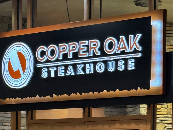 That glowing sign is like a lighthouse for steak lovers lost in a sea of ordinary dining.