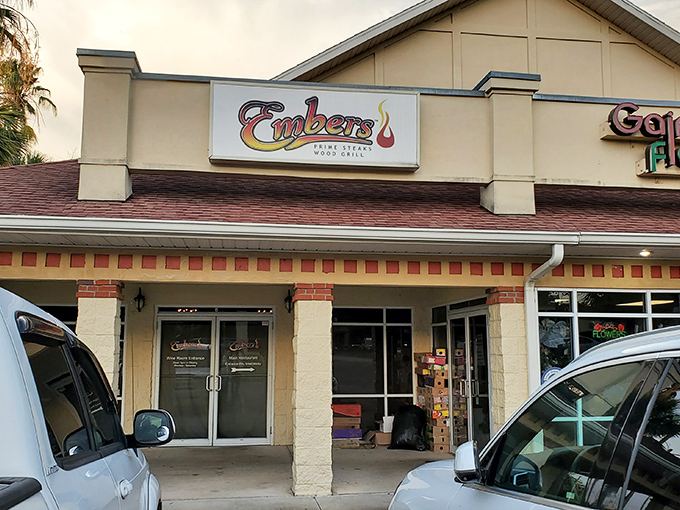 Embers Wood Grill's understated storefront hides culinary magic within - like finding a diamond in a strip mall setting.