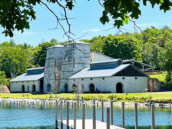 Fayette's historic stone buildings tell tales of Michigan's industrial past, now standing like ancient ruins against a backdrop of natural beauty.