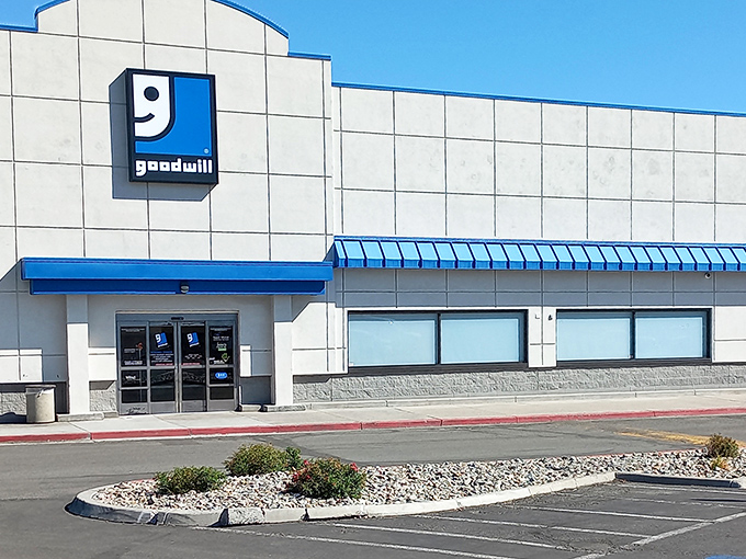 Goodwill's iconic smiling logo welcomes you to a warehouse of wonders. That blue awning practically winks at passing bargain hunters!