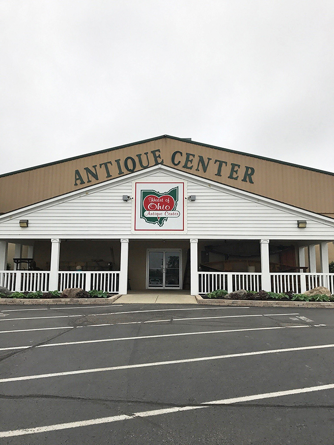 Heart of Ohio Antique Center welcomes visitors with its charming white columns and a world of wonders waiting inside.