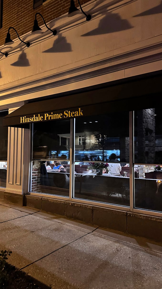 Hinsdale Prime Steak's elegant storefront glows with possibility after dark. Like a jewelry box, but the gems inside are edible.