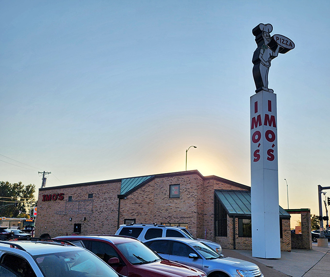 That towering chef statue stands like the St. Louis Arch of pizza &ndash; a beacon guiding hungry souls to thin-crust paradise.