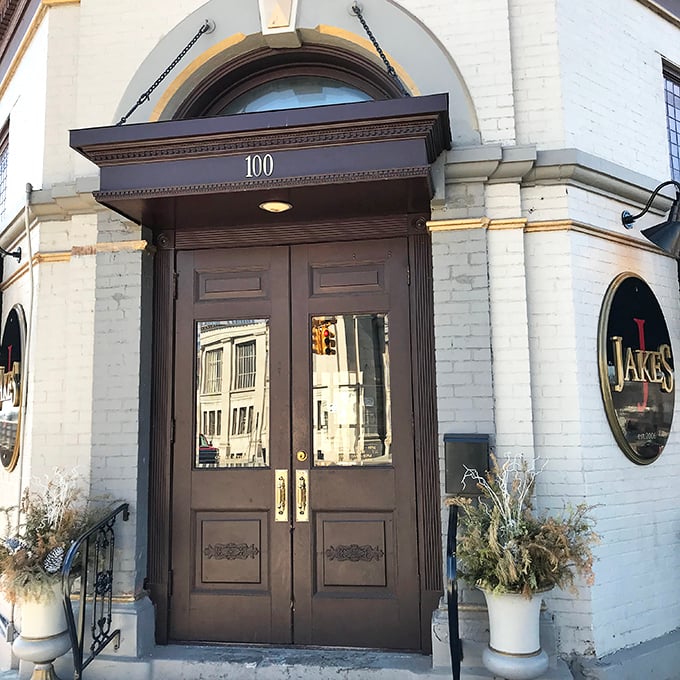 Jake's Old City Grill's elegant entrance whispers of Saginaw history and sizzling steaks waiting inside.