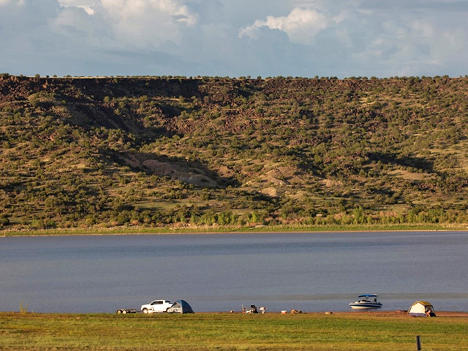 Lyman Lake's vast waters stretch toward the horizon, offering a refreshing escape from Arizona's famous heat.