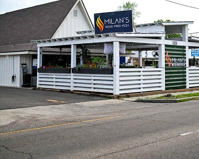 A humble white building housing pizza magic. Where wood-fired dreams come true in Hammond.