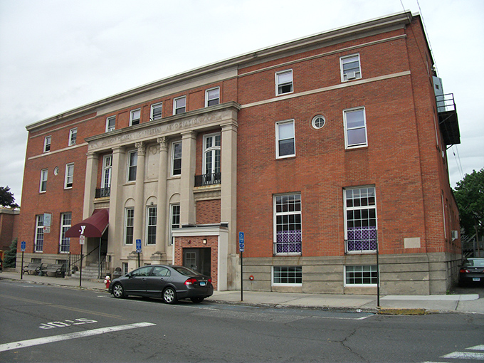 Naugatuck's historic downtown showcases classic brick architecture under brilliant blue skies, where affordable living meets small-town character.