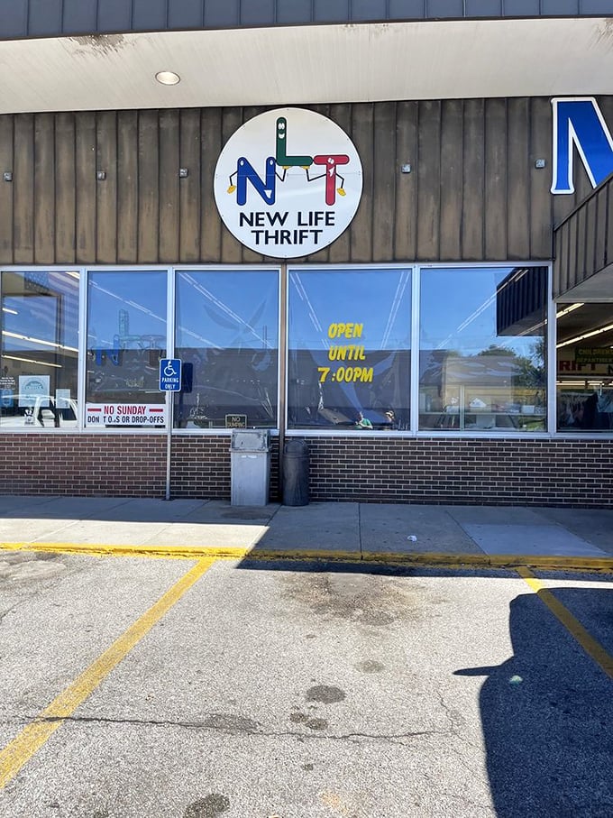 New Life Thrift's cheerful sign promises extended hours for serious treasure hunters. No Sunday shopping means Monday morning madness!