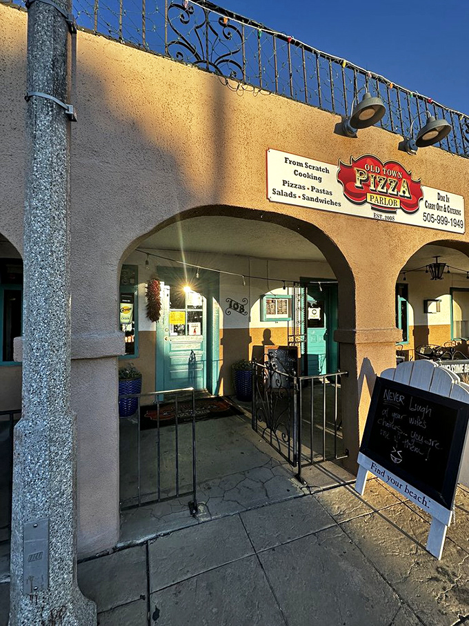 Old Town Pizza Parlor's charming adobe entrance feels like stepping into pizza history. Those arches have witnessed countless cheese pulls.