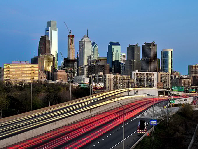 Philadelphia's iconic skyline stretches toward the clouds like a modern-day Emerald City. The highway light trails below look like ruby slippers leading you home.