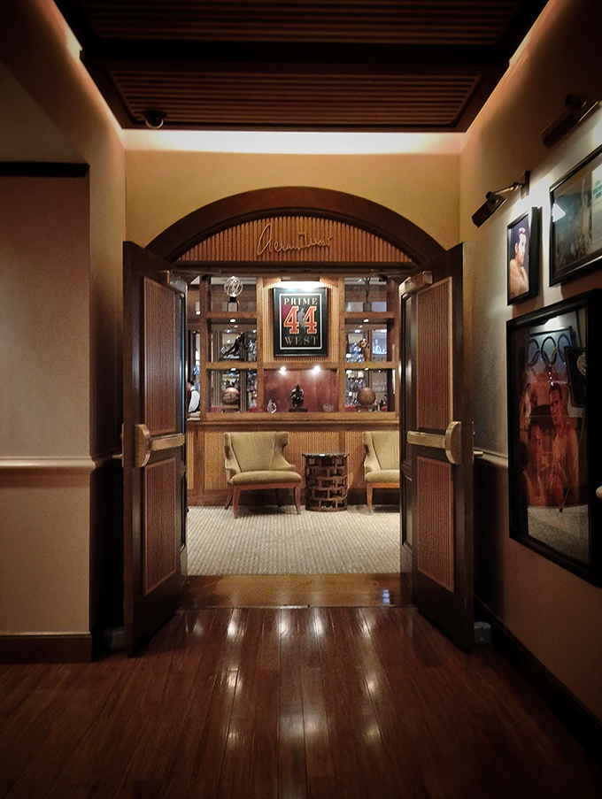 Behind these doors lies Prime 44 West's inner sanctum, where basketball memorabilia meets culinary mastery in perfect harmony.