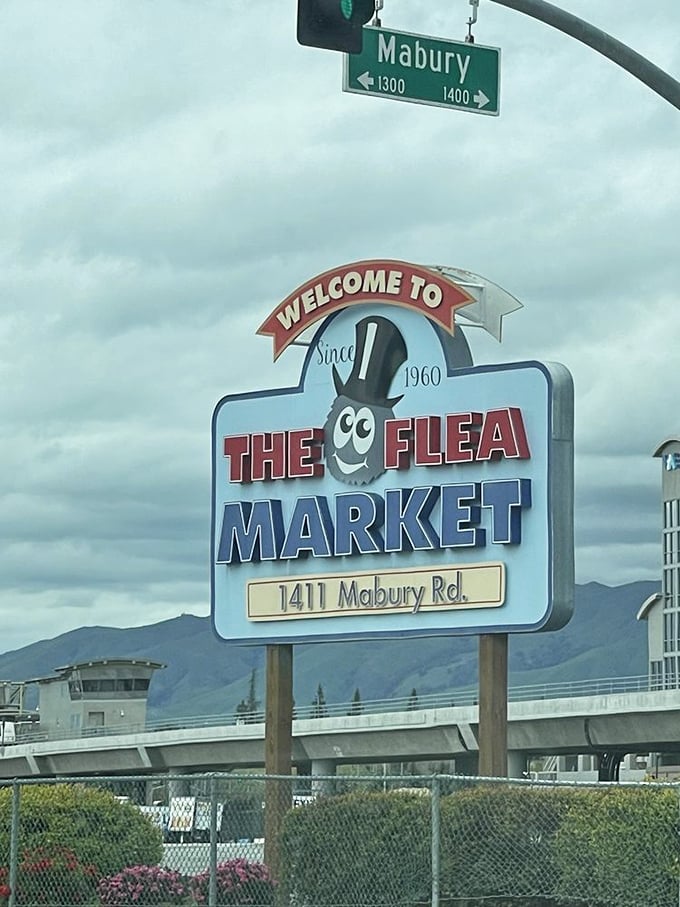 The San Jose Flea Market sign stands tall, like a carnival barker inviting you to the greatest show of stuff on earth.
