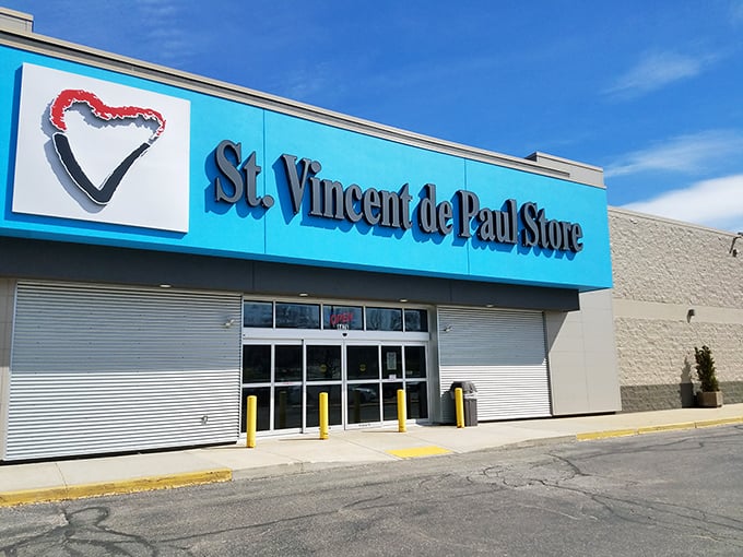 That blue sign means bargains ahead! St. Vincent de Paul's cheerful storefront is like a beacon for thrift enthusiasts.