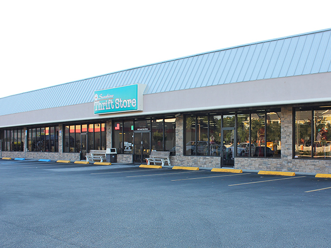 Sunshine Thrift Store lives up to its name with a bright blue roof that signals bargain paradise ahead.