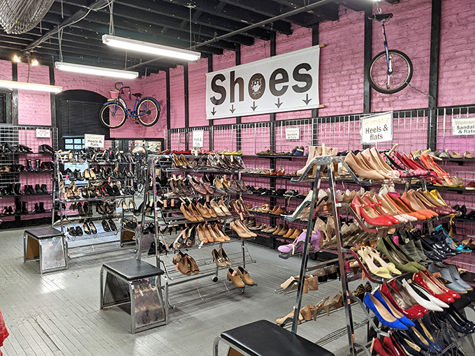 The Garment District's pink shoe wall is like Dorothy's dream closet exploded in the best possible way.