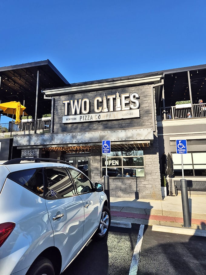 Two Cities Pizza Co. stands tall with its modern design and inviting patio. New York meets Chicago in this architectural showstopper.