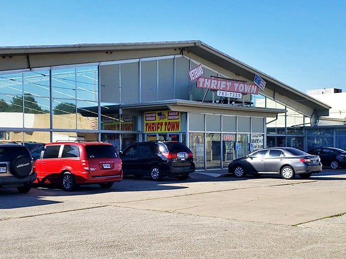 Veterans Thrift Town's retro sign beckons like a neon promise of vintage treasures waiting to be discovered.