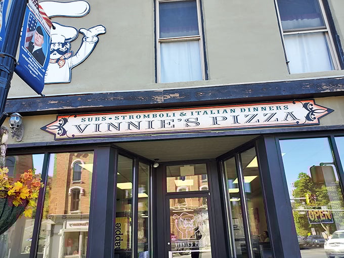 Vinnie's unassuming storefront proves the best pizza often hides behind the most humble facades in small towns.