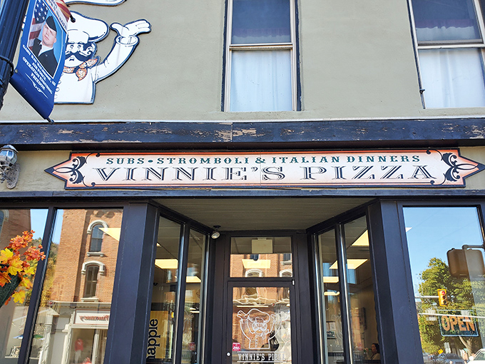 Vinnie's charming vintage sign promises three Italian food groups &ndash; subs, stromboli, and dinner. But the pizza steals the show!