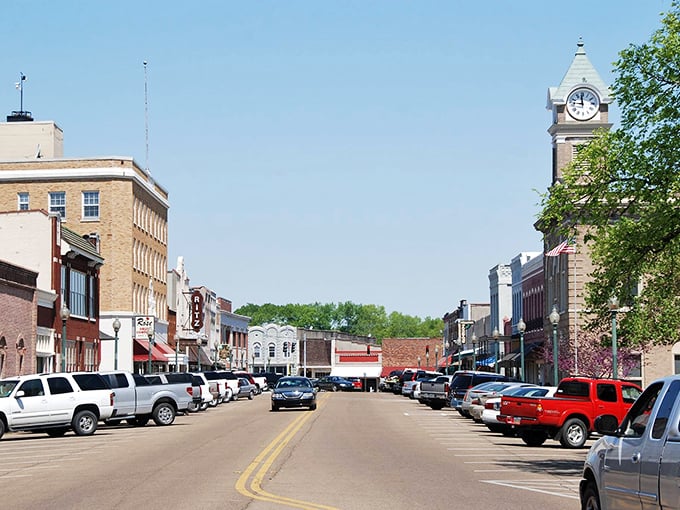 West Point's colorful downtown storefronts pop against the blue Mississippi sky, offering charm that costs nothing but appreciation.