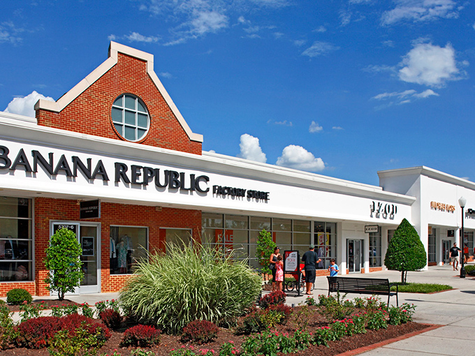 Banana Republic Factory Store, where your wallet breathes easier but your style doesn't suffer. The distinctive brick architecture adds charm to your shopping adventure.