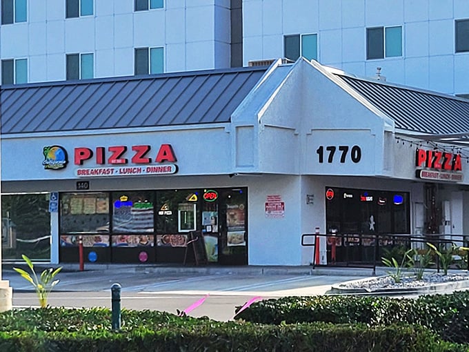 Nothing says "vacation mode activated" like a no-frills pizza spot that promises breakfast, lunch AND dinner pizza possibilities.